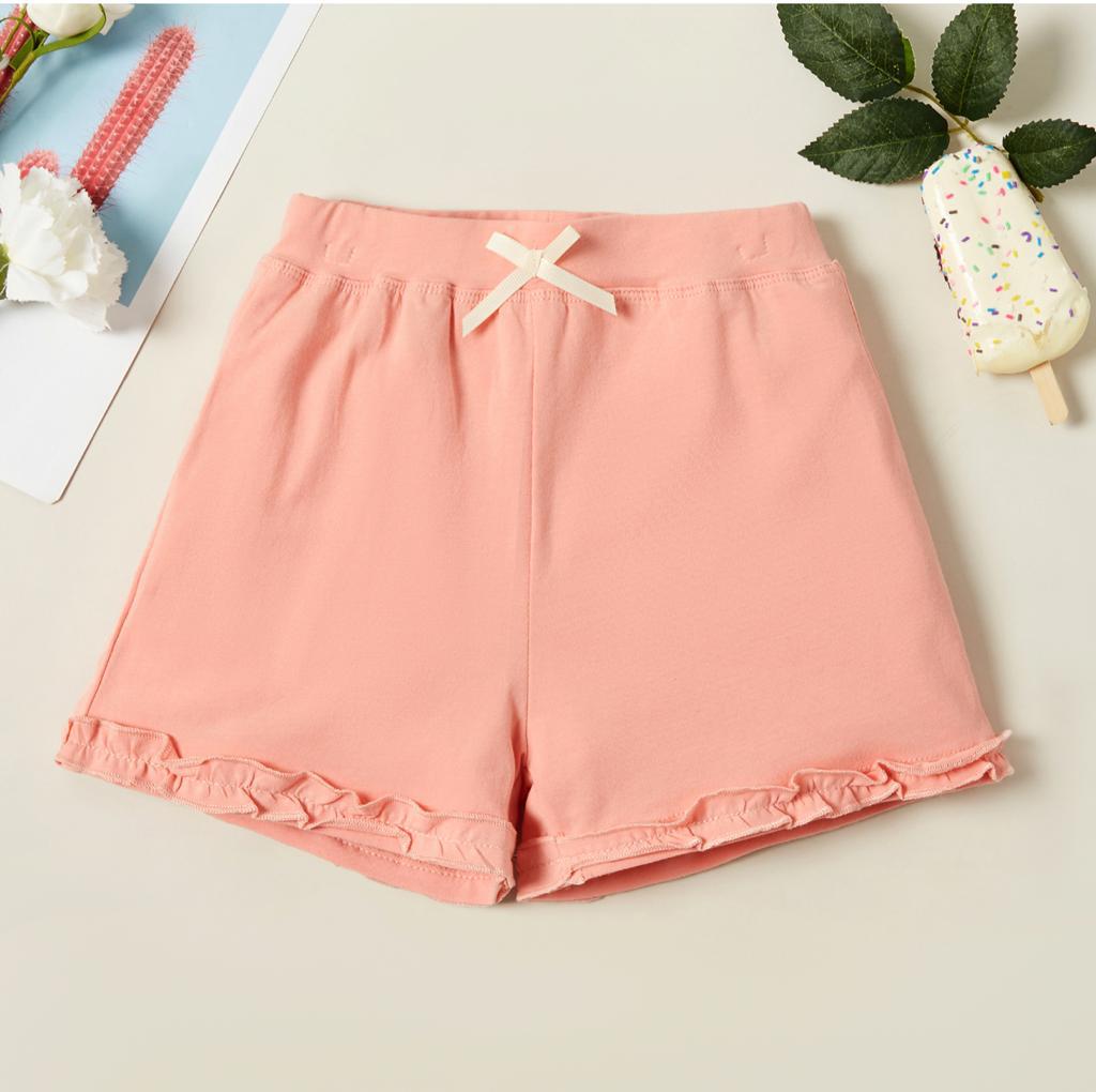 Short rosado con chongo blanco. – Crece Kids